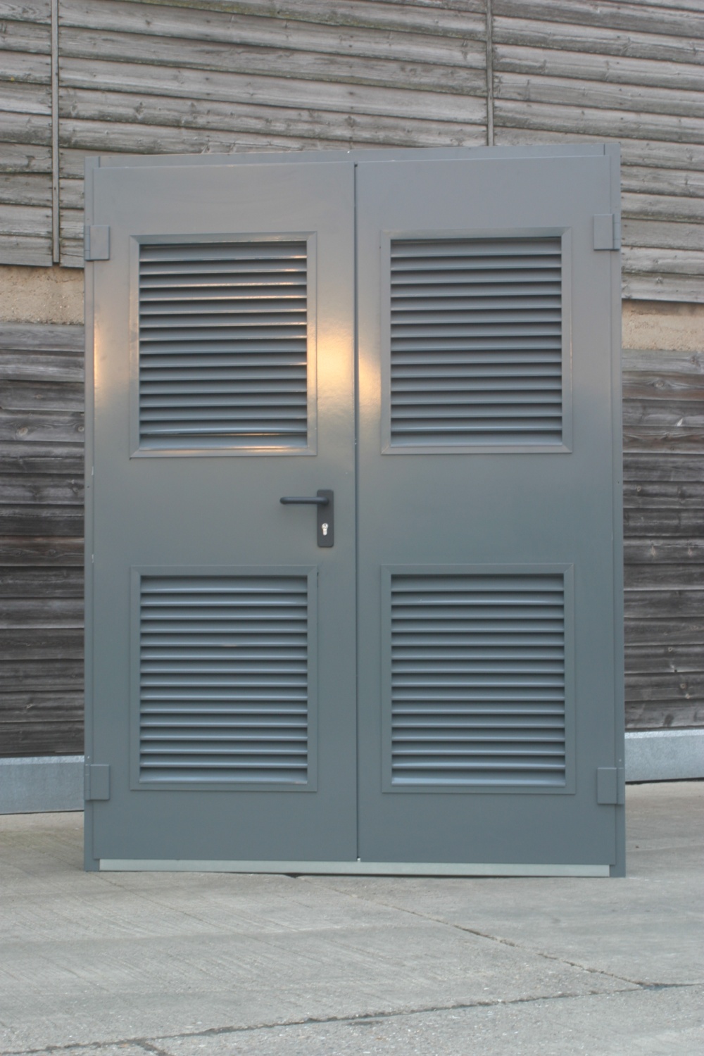 Steel Door Vision panels - powder coat and stainless steel.