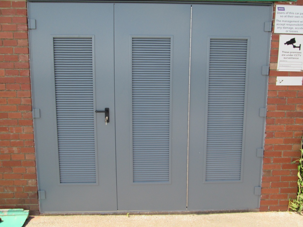 Steel Door Vision panels - powder coat and stainless steel.