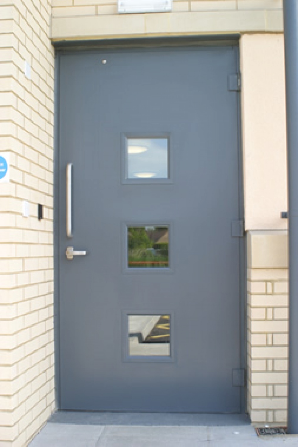 Steel Door Vision panels - powder coat and stainless steel.
