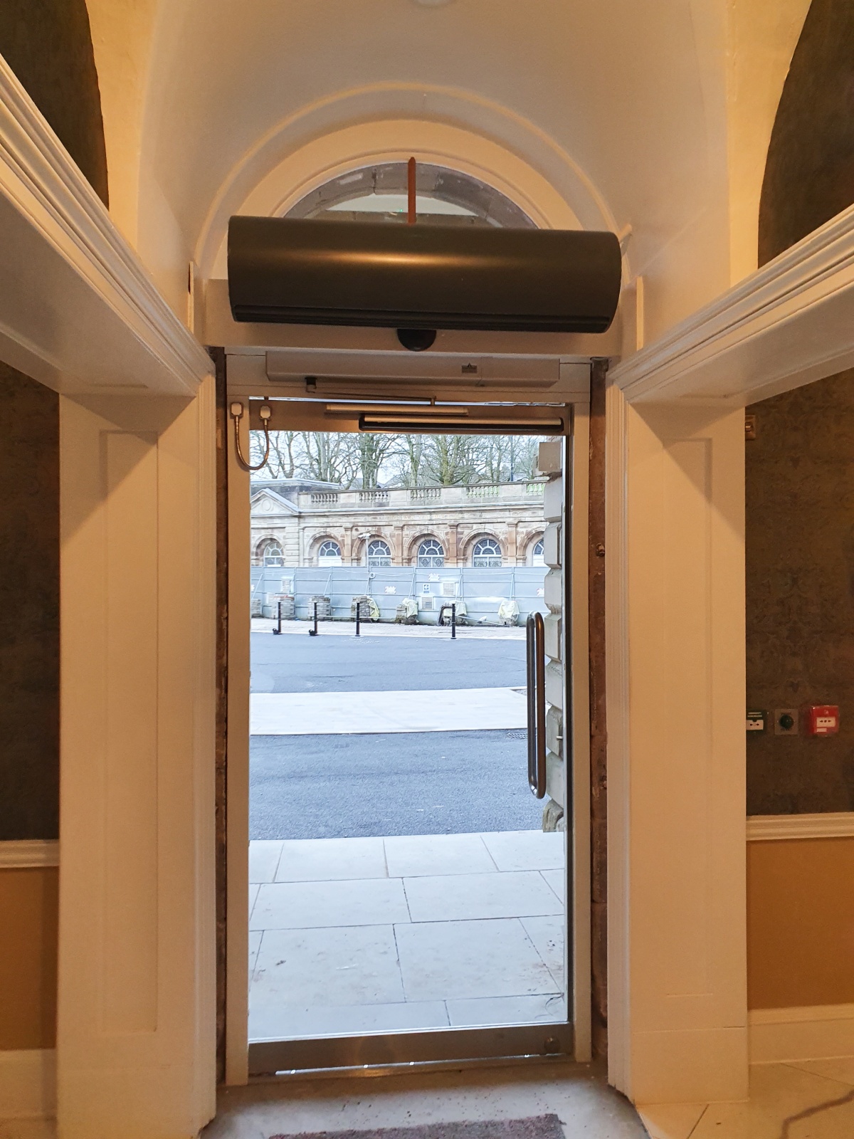 Powered glass door for historic building